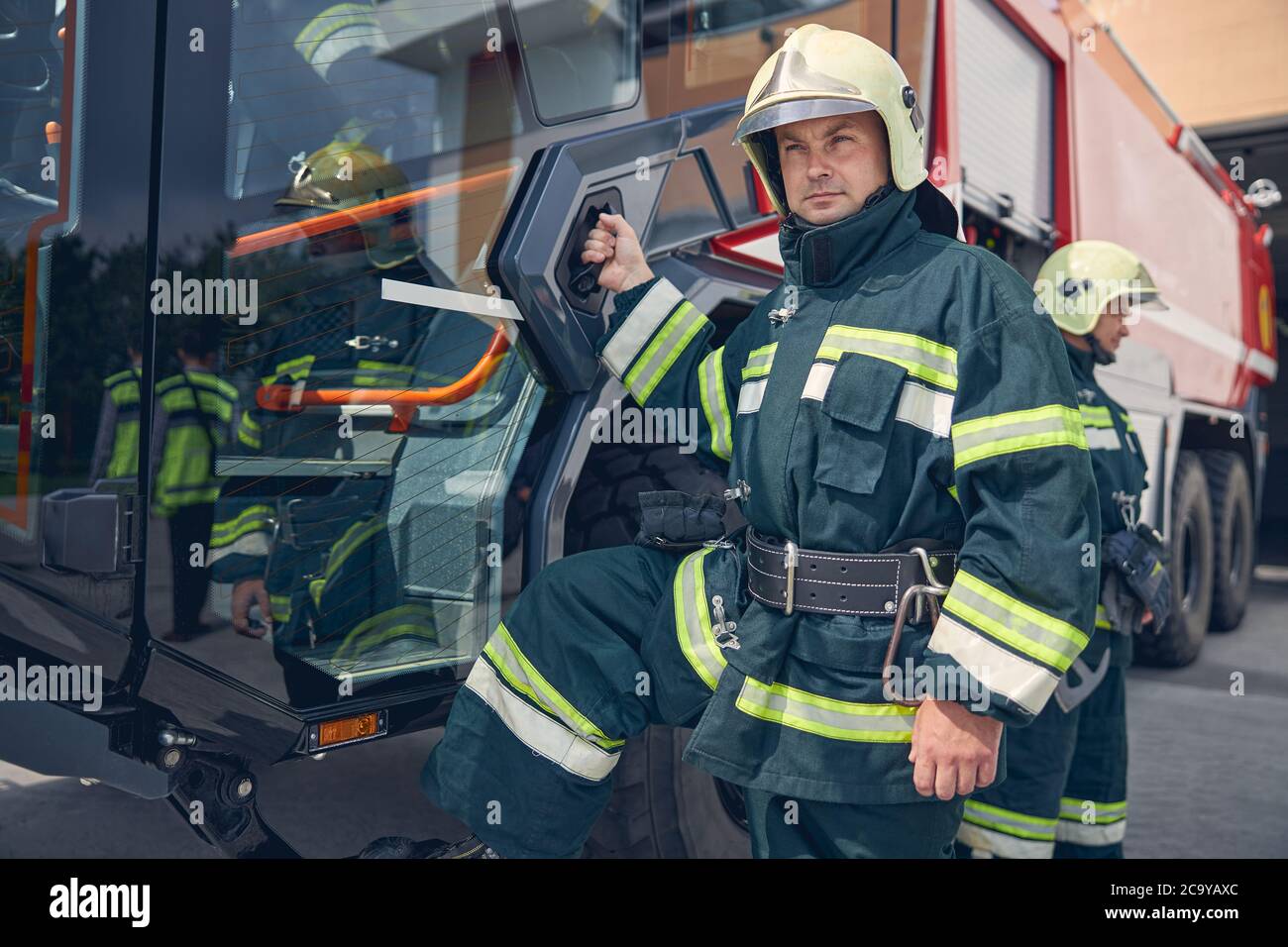 Portrait of a white adult male lifeguard in the outdoors with natural ...