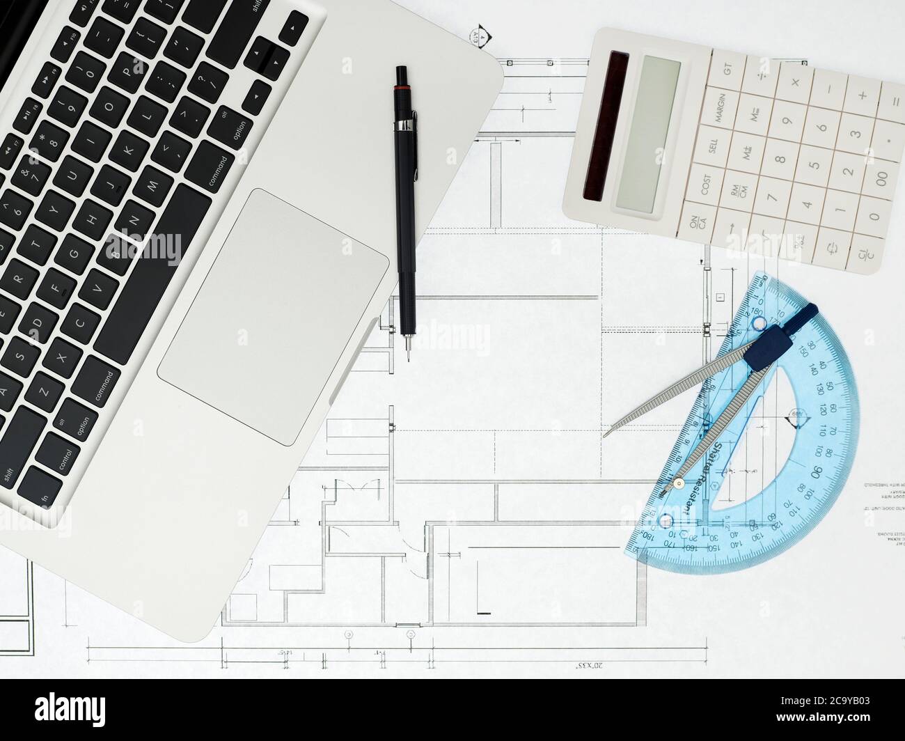 Blueprints and laptop Stock Photo - Alamy