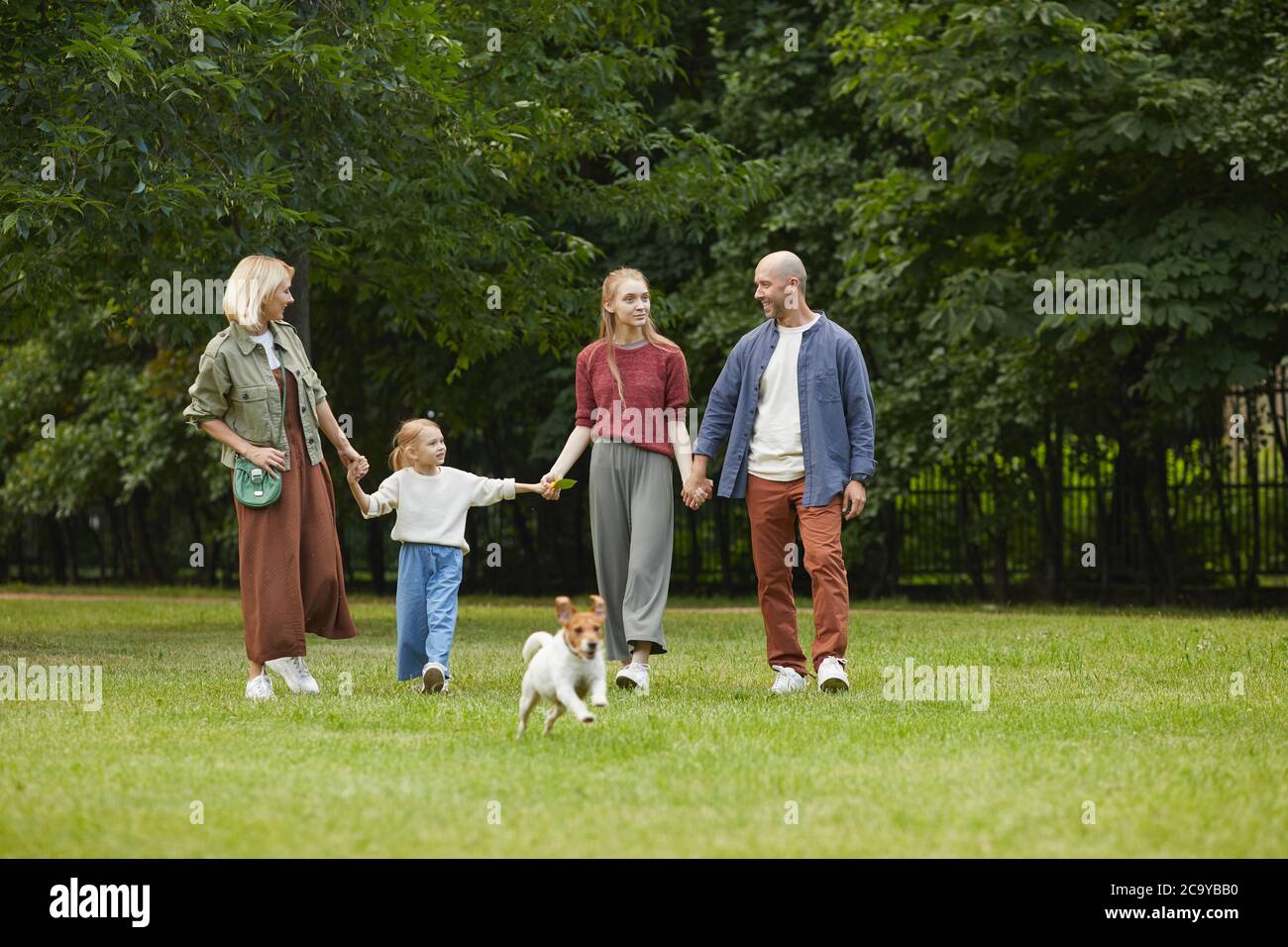 Family with two kids and dog hi-res stock photography and images - Alamy