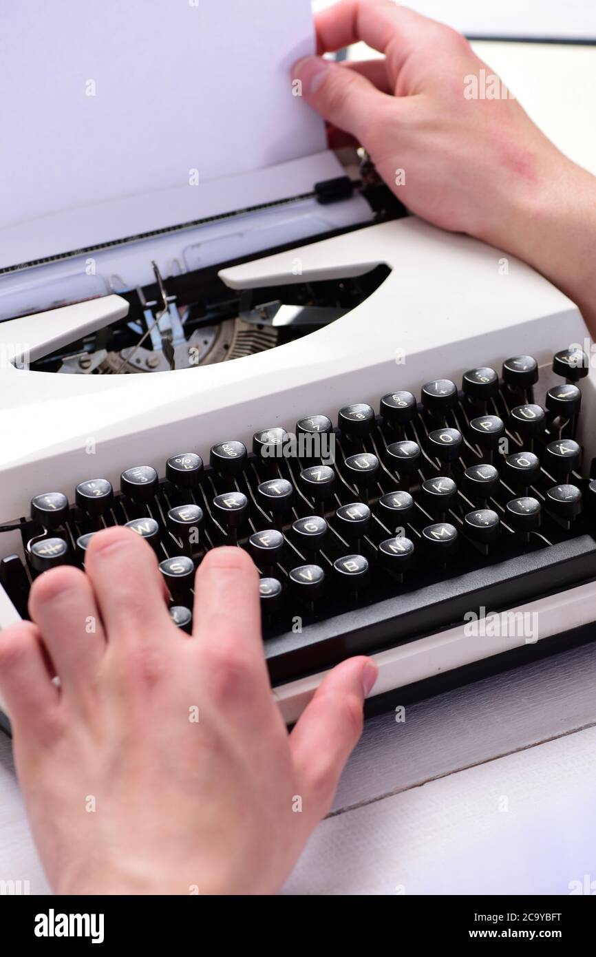 Writer typing with retro writing machine. Typography and writing ...