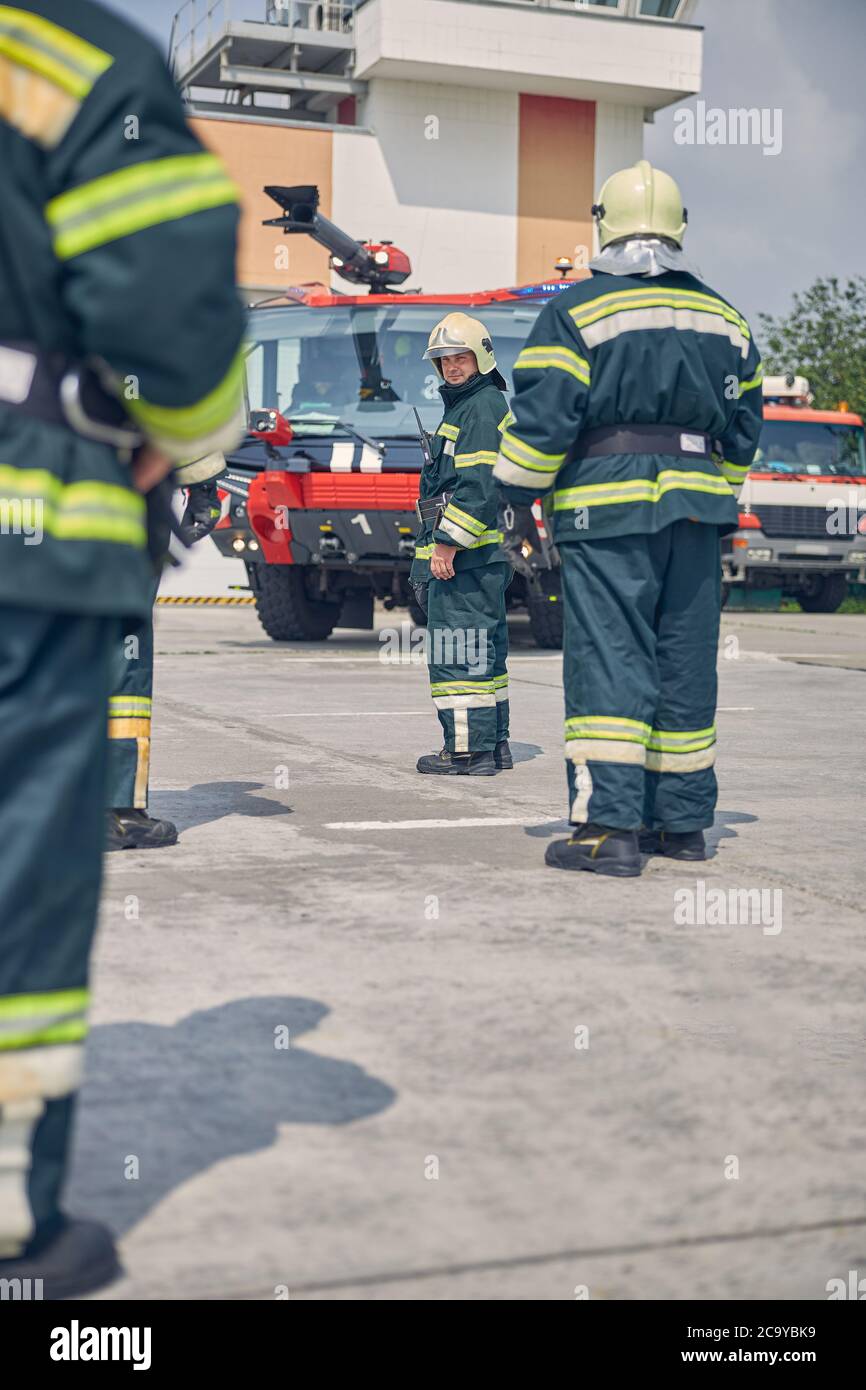Fire men standing in fire truck hi-res stock photography and images - Alamy