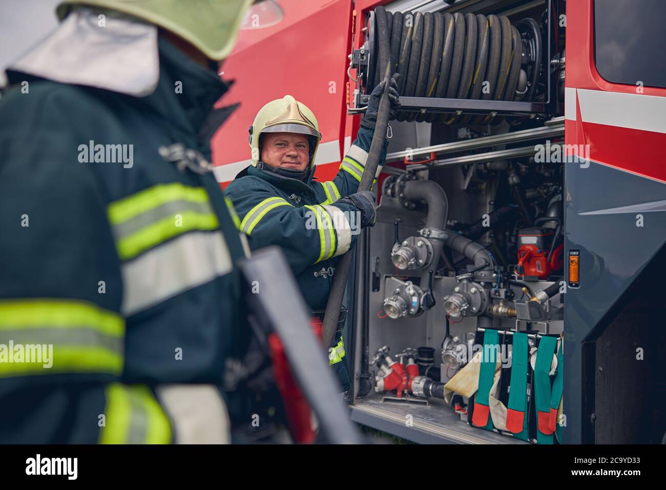 Handsome firefighter hi-res stock photography and images - Alamy