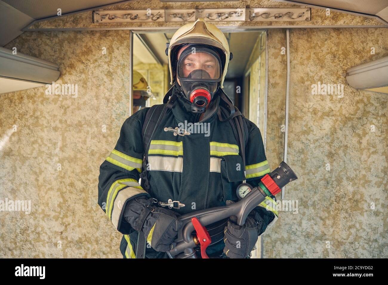 Rescue firefighter in safe helmet and uniform Stock Photo - Alamy