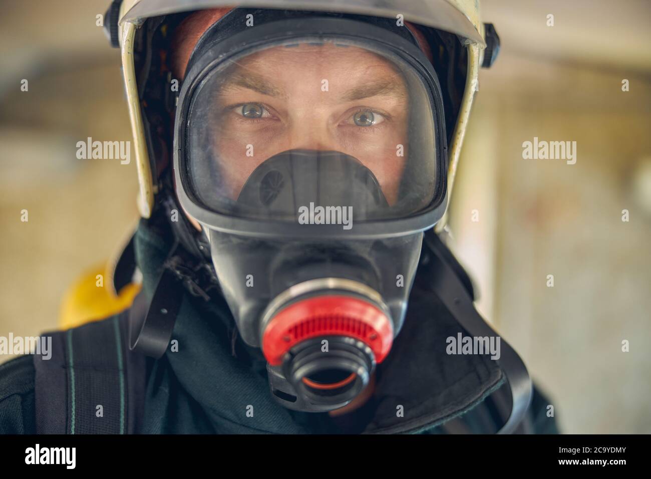 Firefighter with mask and helmet hi-res stock photography and images ...