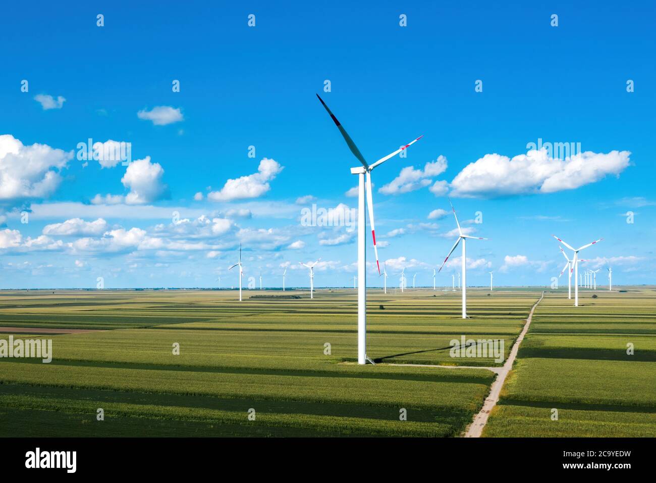 Aerial view of wind turbines on modern wind farm from drone pov, high ...