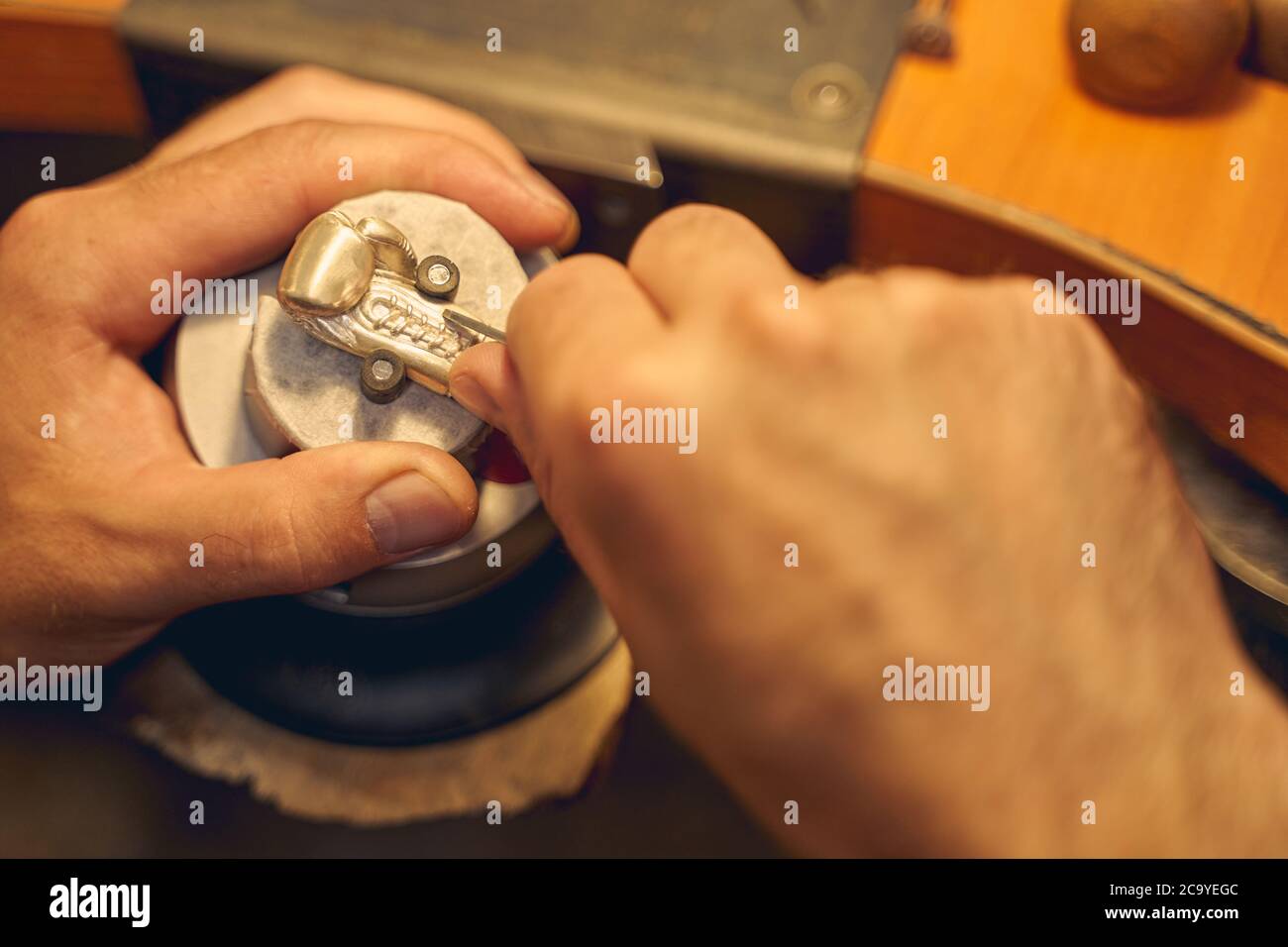 Experienced professional engraver working in a shop Stock Photo - Alamy