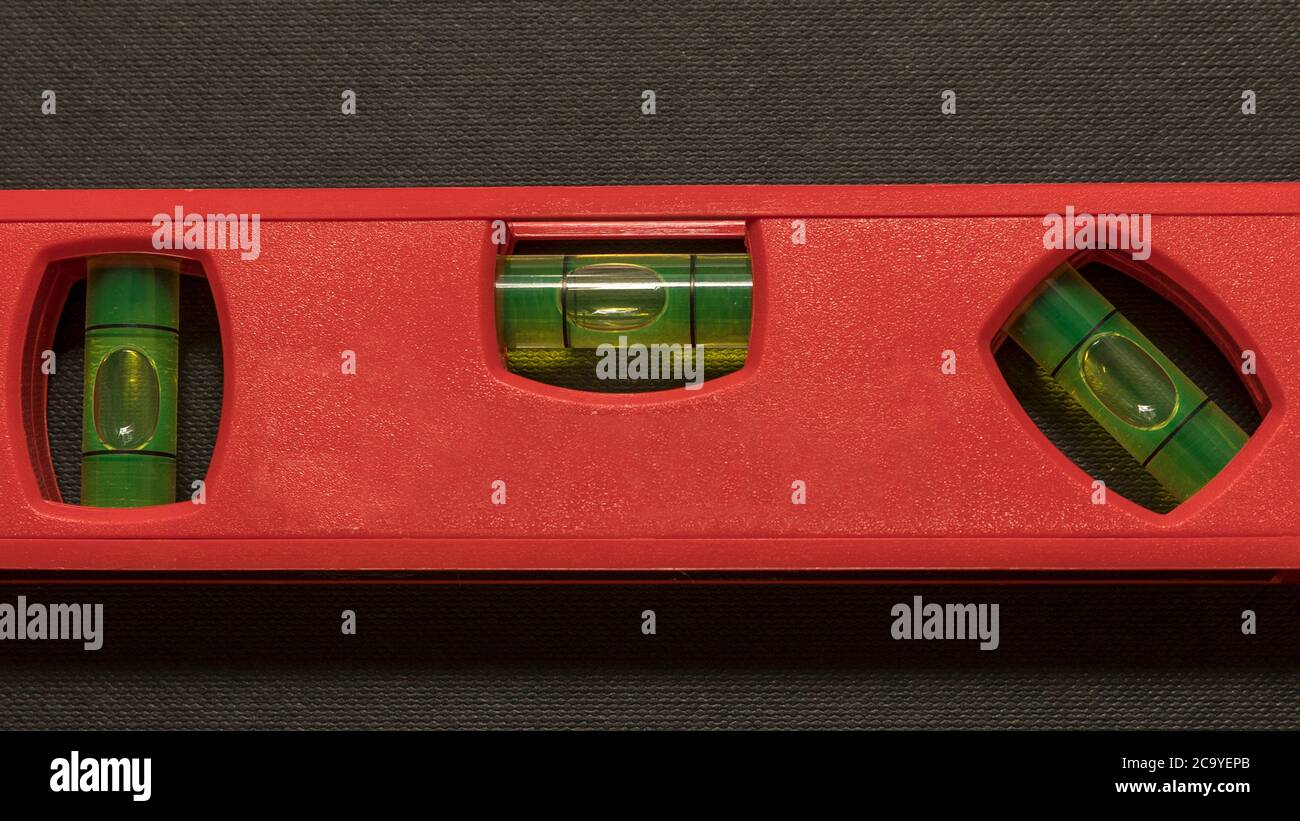 Red spirit level with bubble to balance the surface with clipping path ...