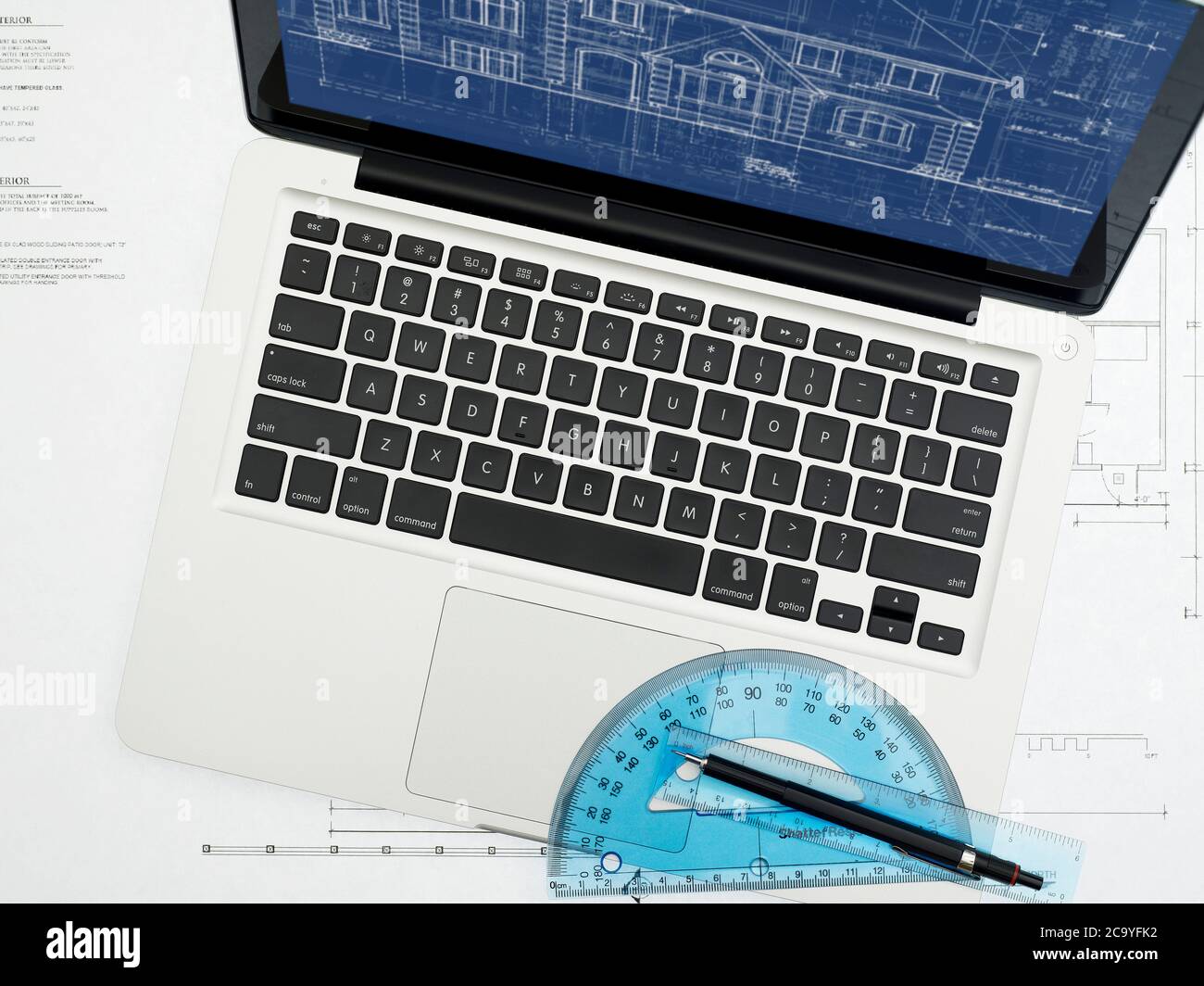 Blueprints and laptop view from above Stock Photo - Alamy