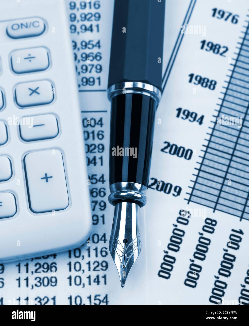 Financial papers, pen and calculator Stock Photo - Alamy