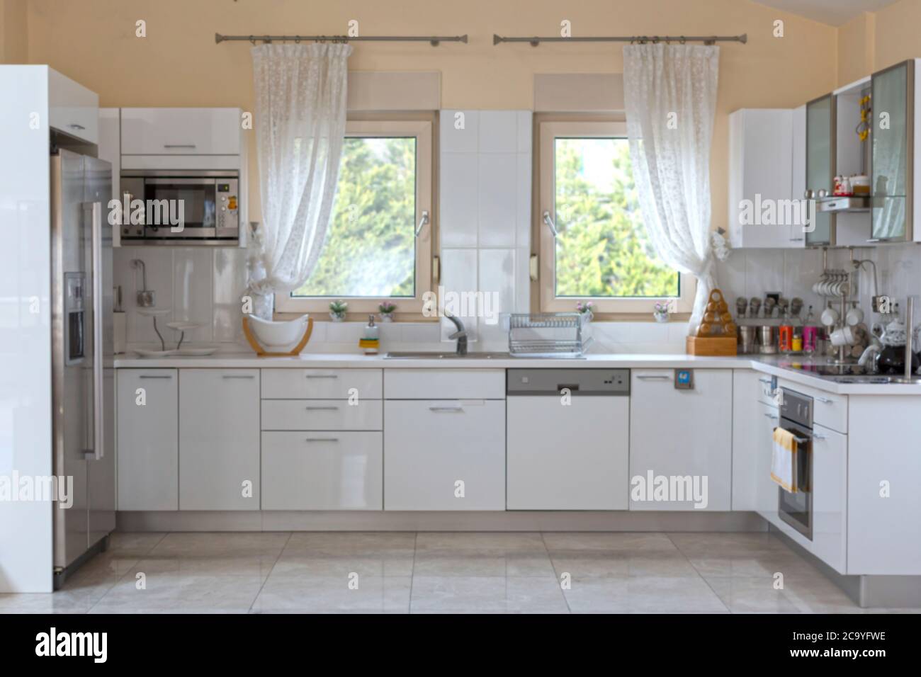 Blurred Kitchen Interior in Light Tones with White Furniture Stock ...