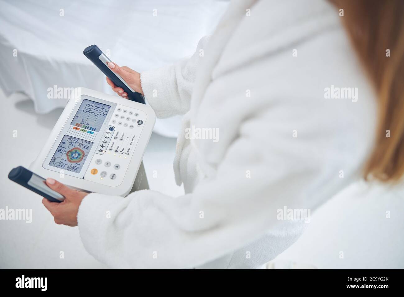 Woman is checking health indicators with body composition analyzed ...