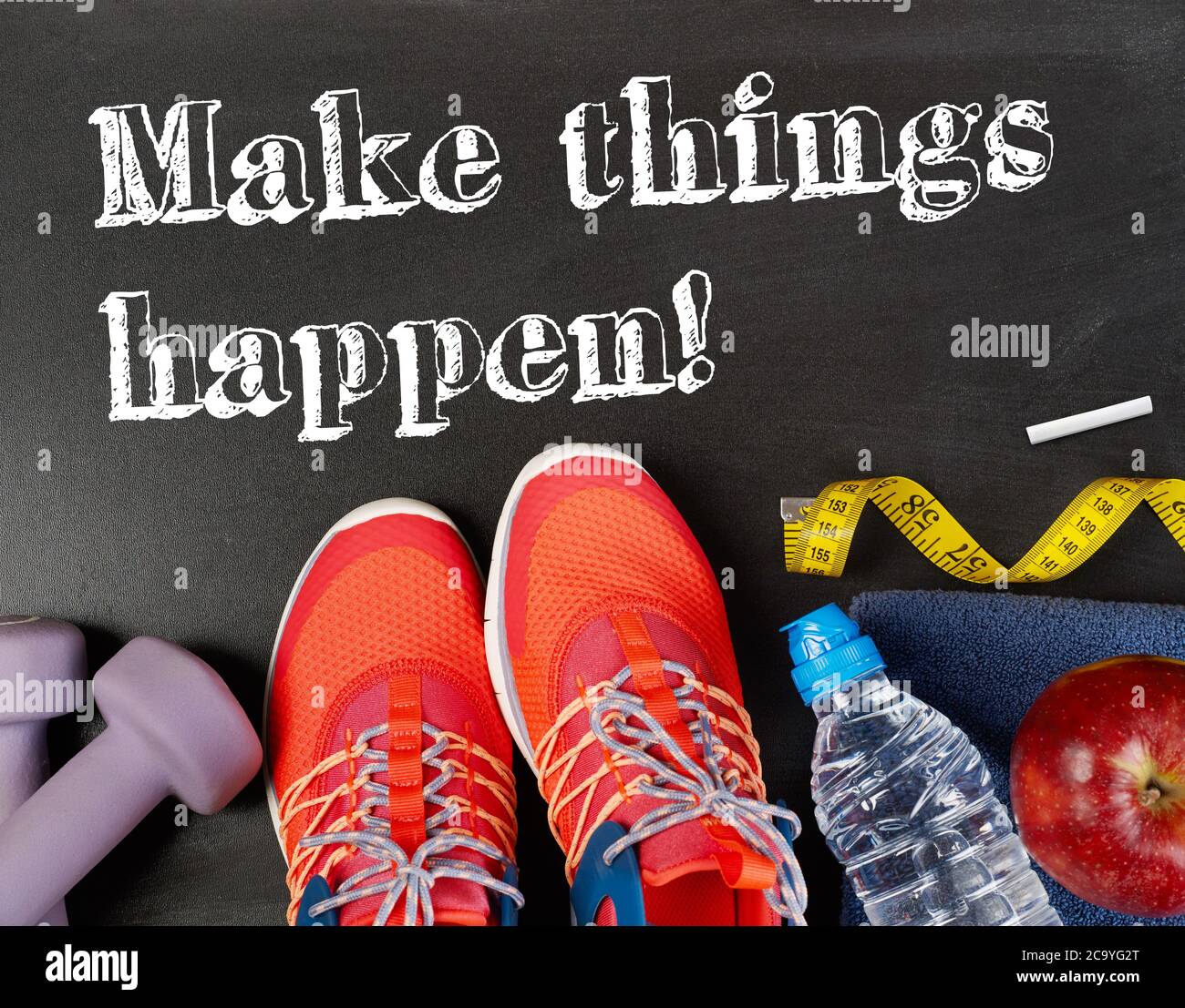 Sport equipment and motivational message on a blackboard Stock Photo ...