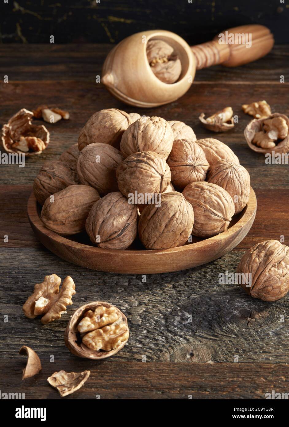 Walnuts on rustic background Stock Photo - Alamy