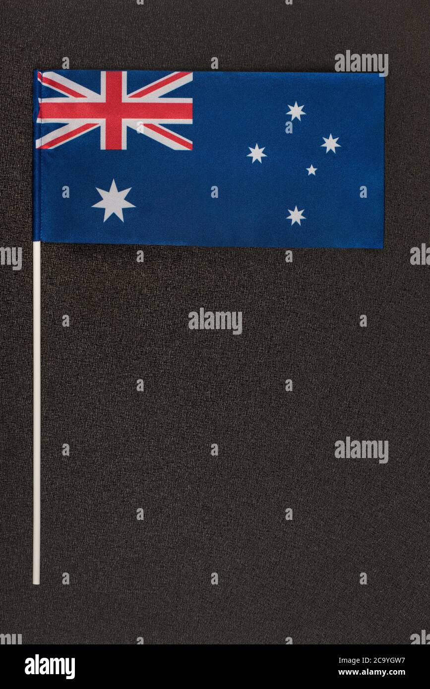 Table flag of Australia on black background. Vertical frame Stock Photo ...