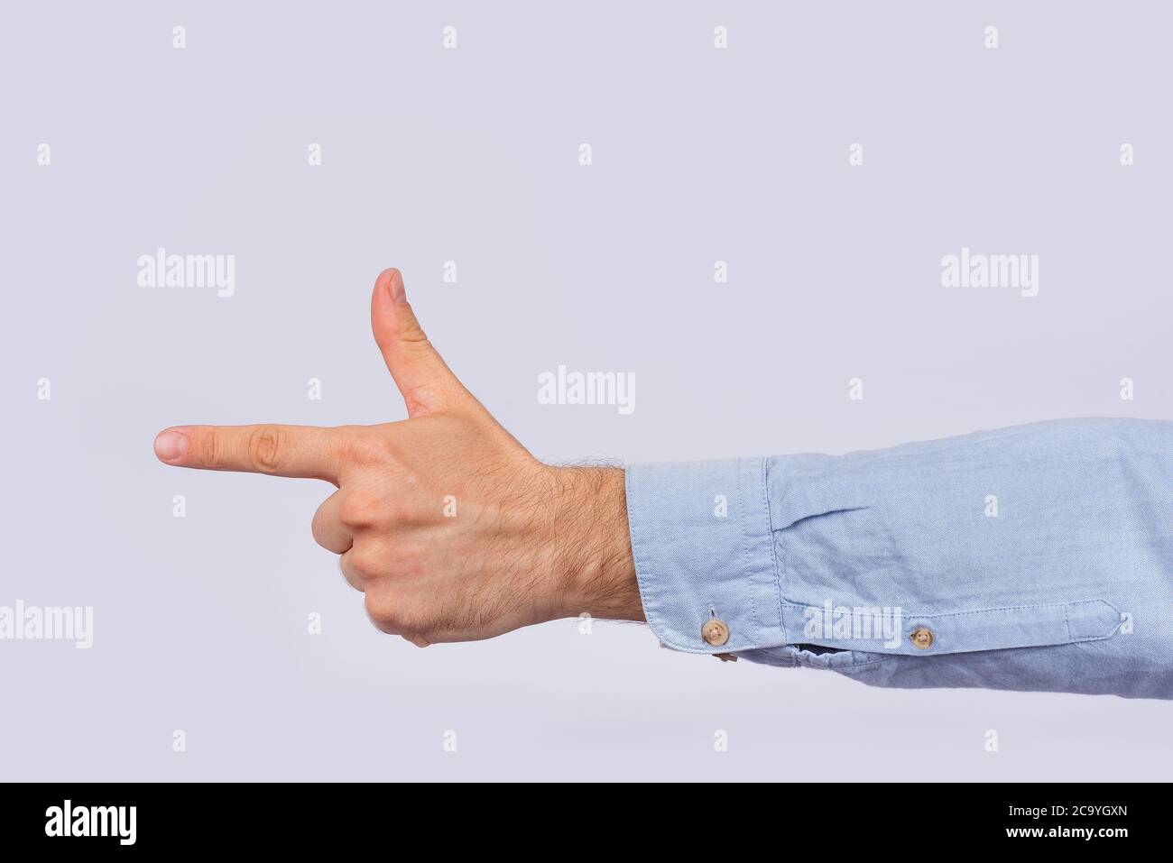 Pointing hand close up on white background. Mans hand indicates ...