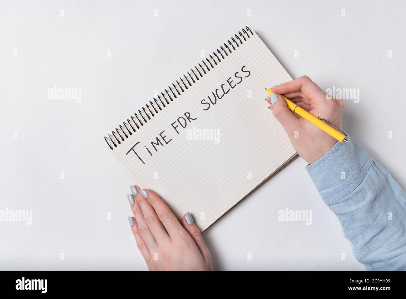 Female hands writes in notepad TIME FOR SUCCESS. White background Stock ...