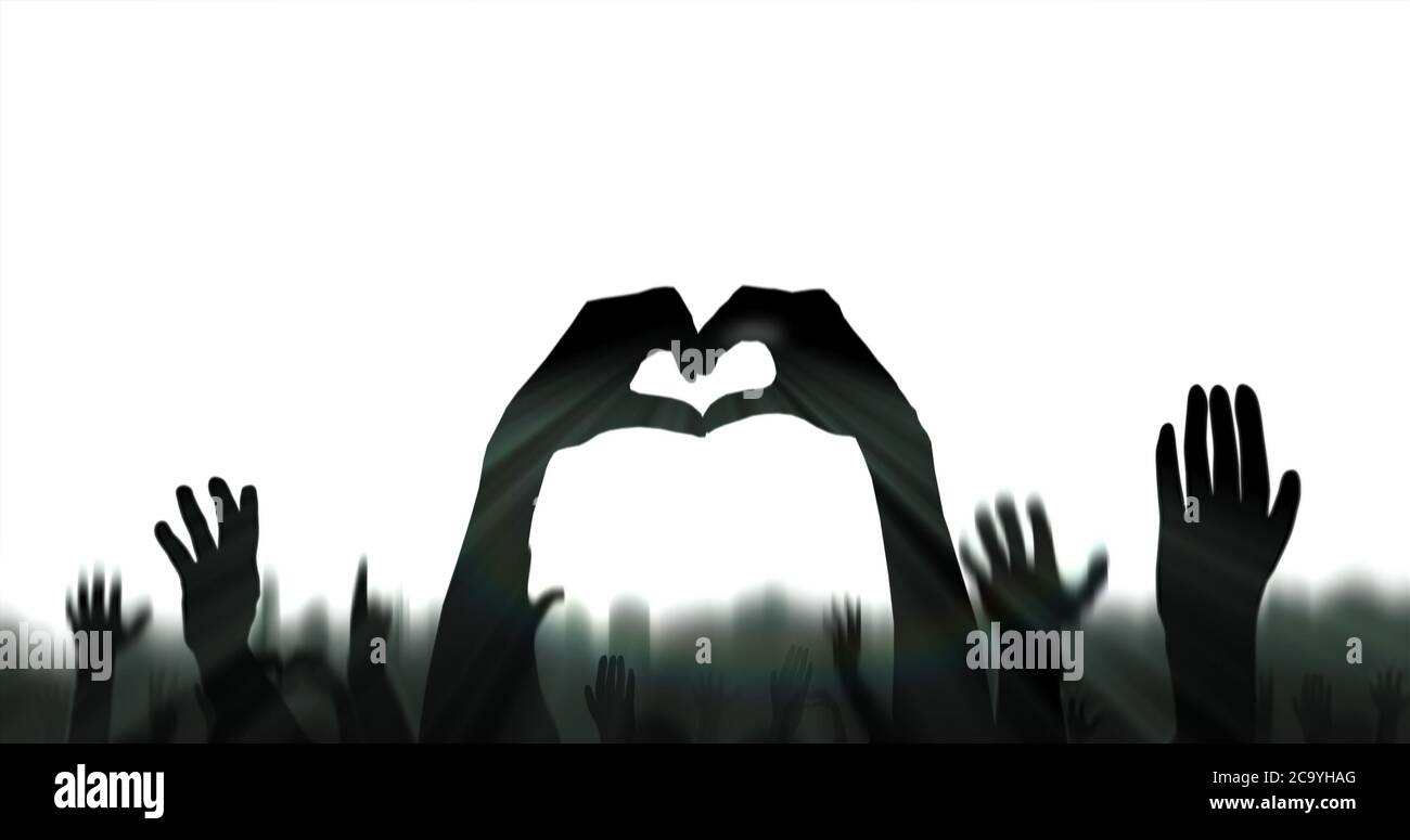 Hands of dark silhouette shapes heart in a crowd celebrating. White ...
