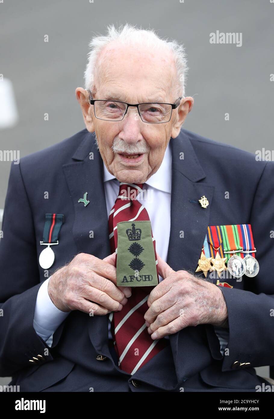 Captain Sir Tom Moore holding an honorary Colonel badge in appointment ...