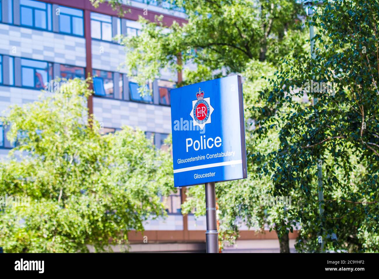 City of Gloucester Police Station sign and trees Stock Photo - Alamy