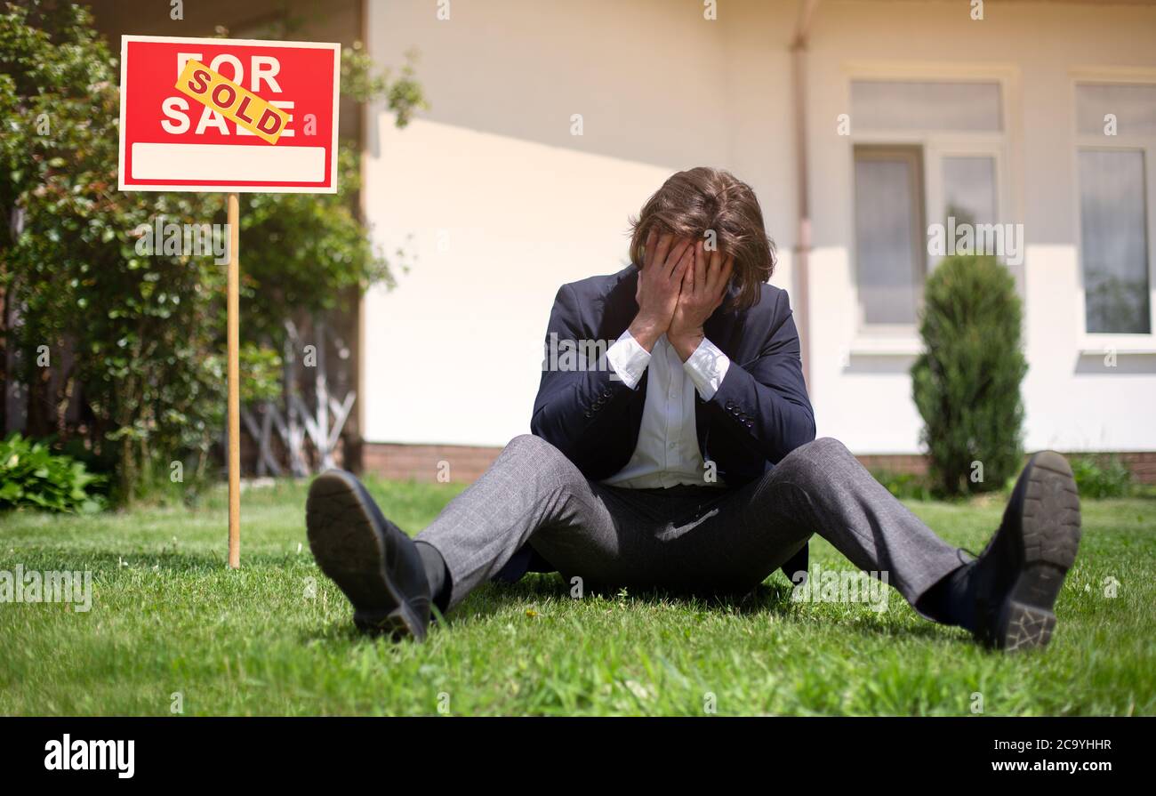 Person unhappy in an estate agent hi-res stock photography and images ...