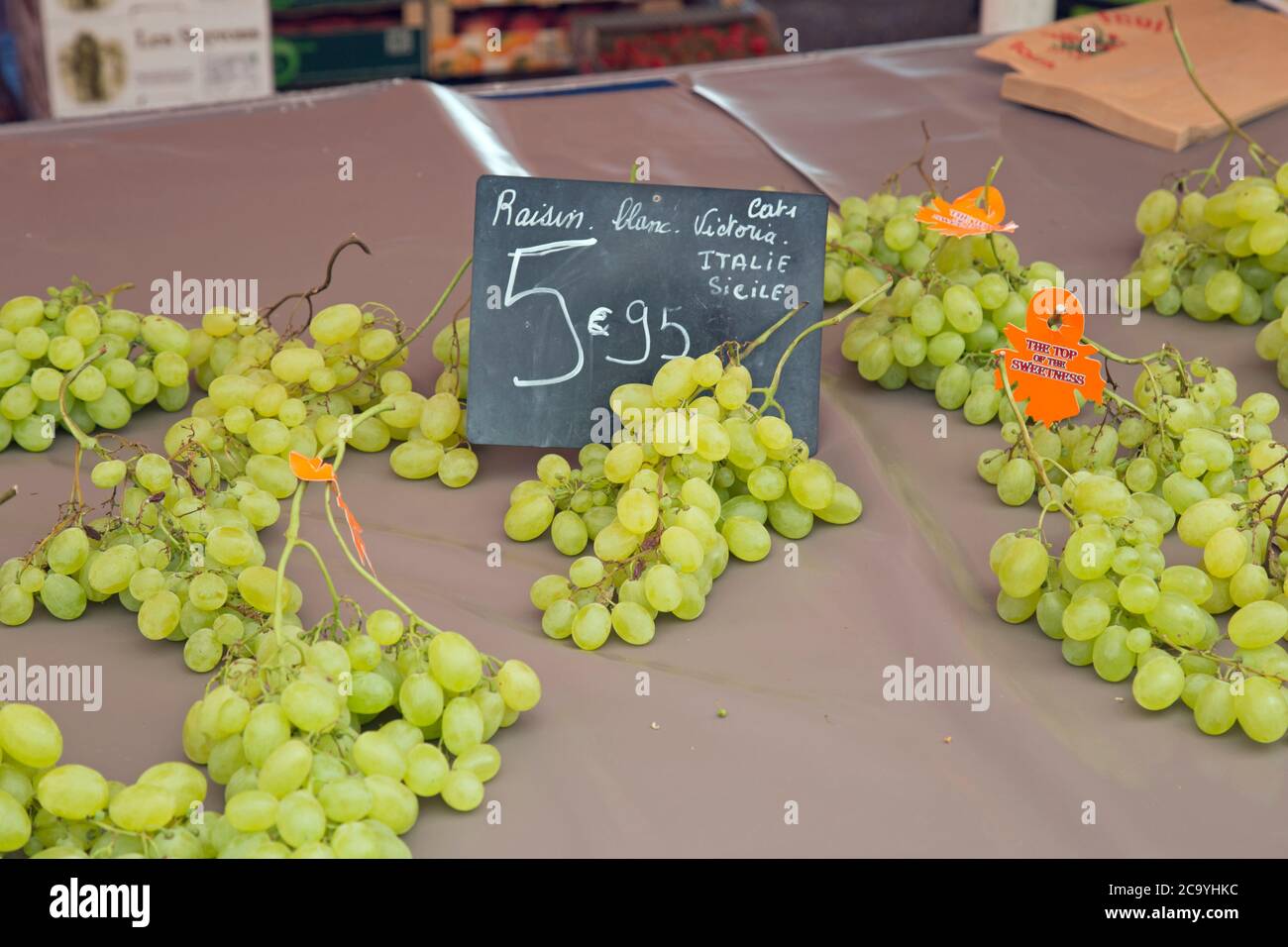 A quantity of fresh green grapes for sale on a French market stall ...