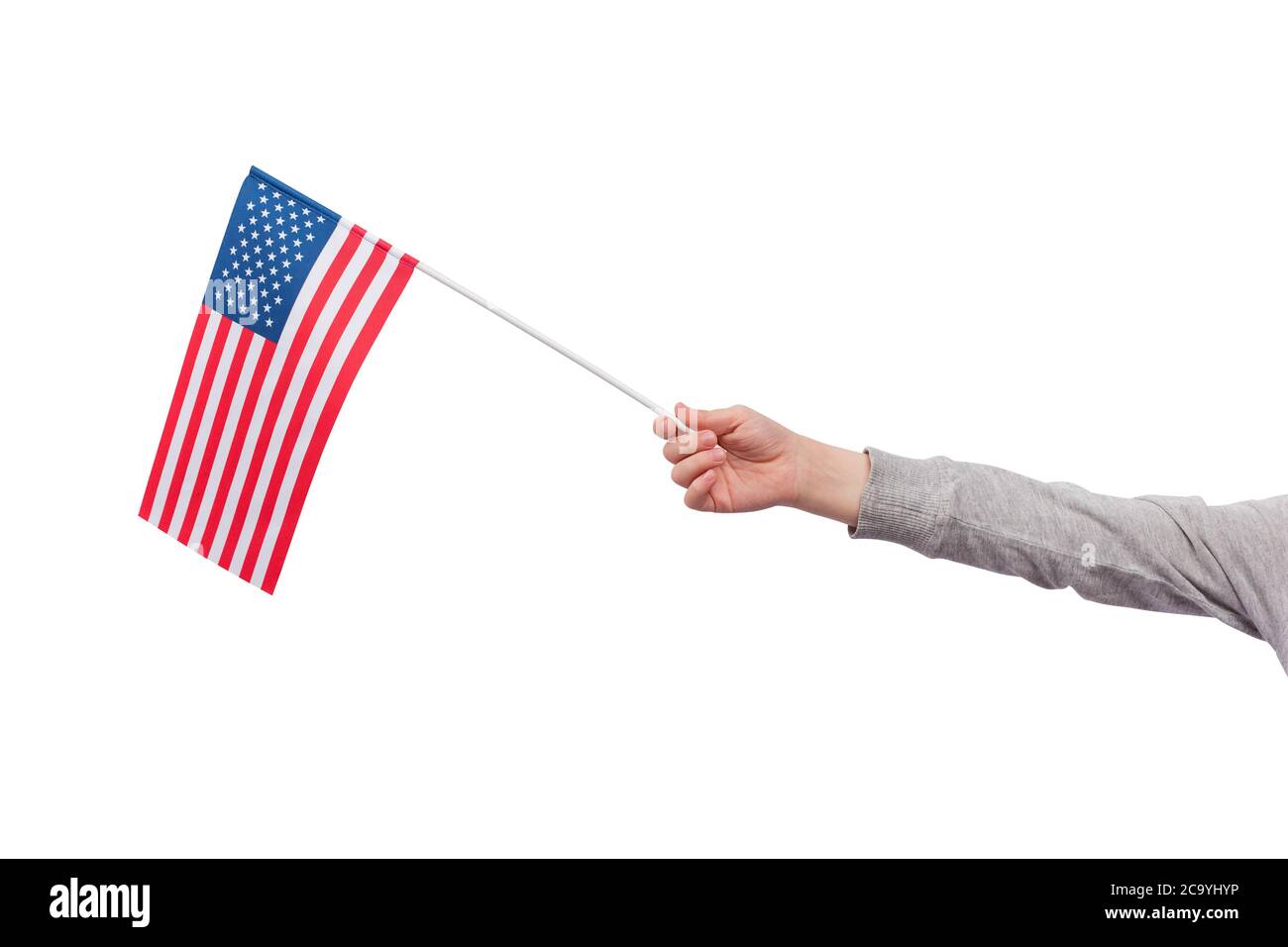 Childrens hand holds the flag of USA isolated on white background. Flag ...