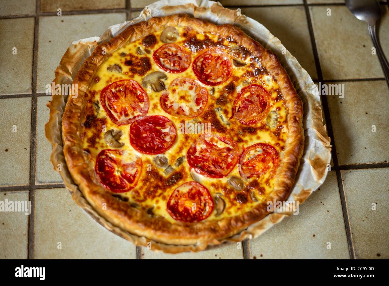 homemade quiche with mushrooms and tomato, french food, top view Stock ...