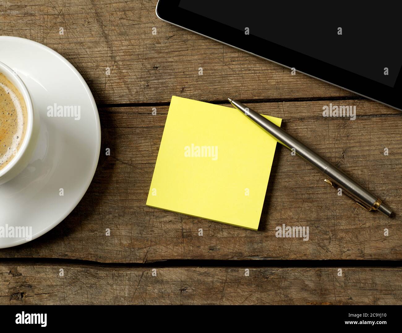 Adhesive note on desk Stock Photo - Alamy