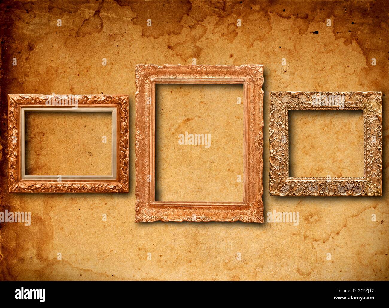 Antique picture frames on wallpaper Stock Photo - Alamy
