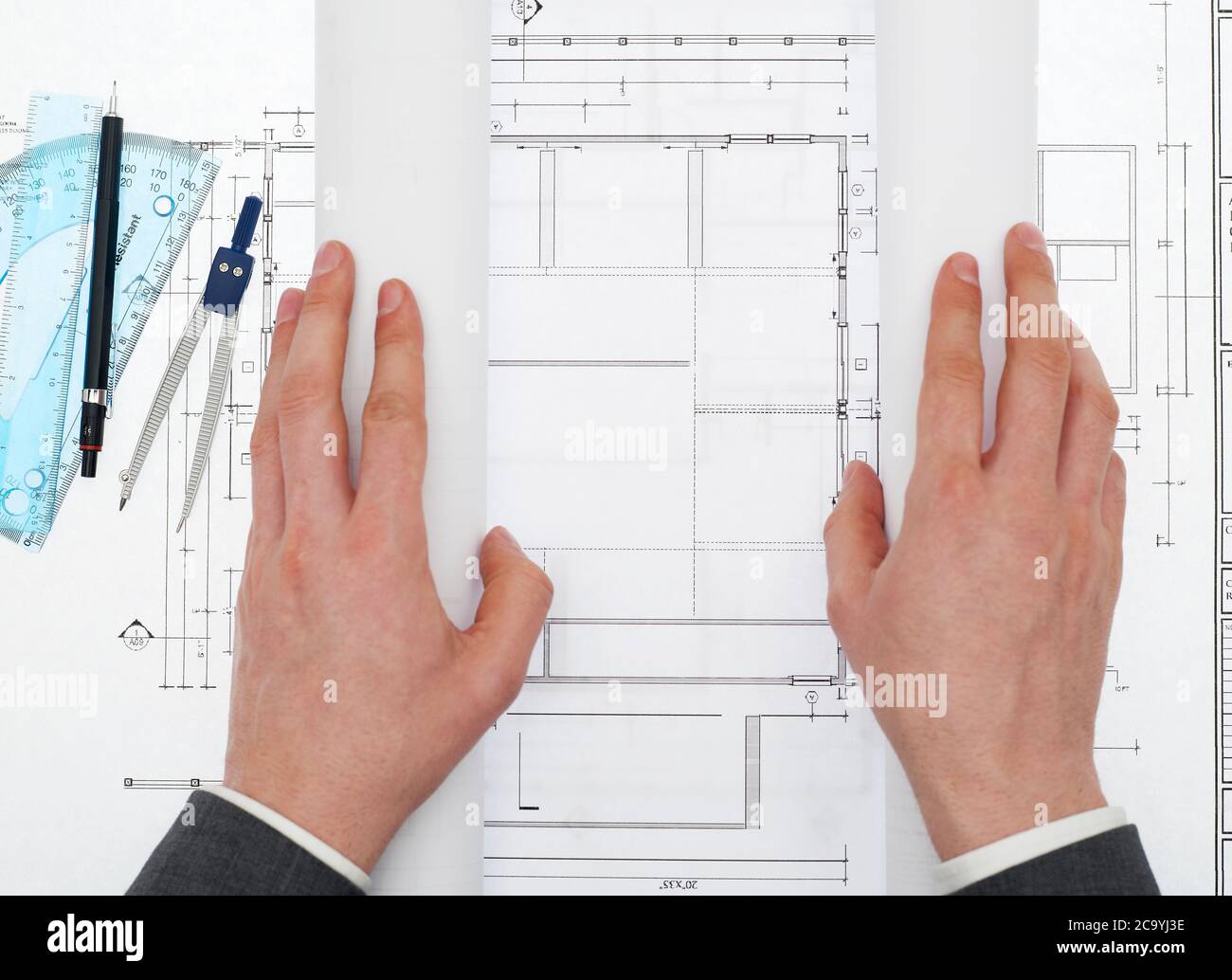 Architect with blueprints Stock Photo - Alamy