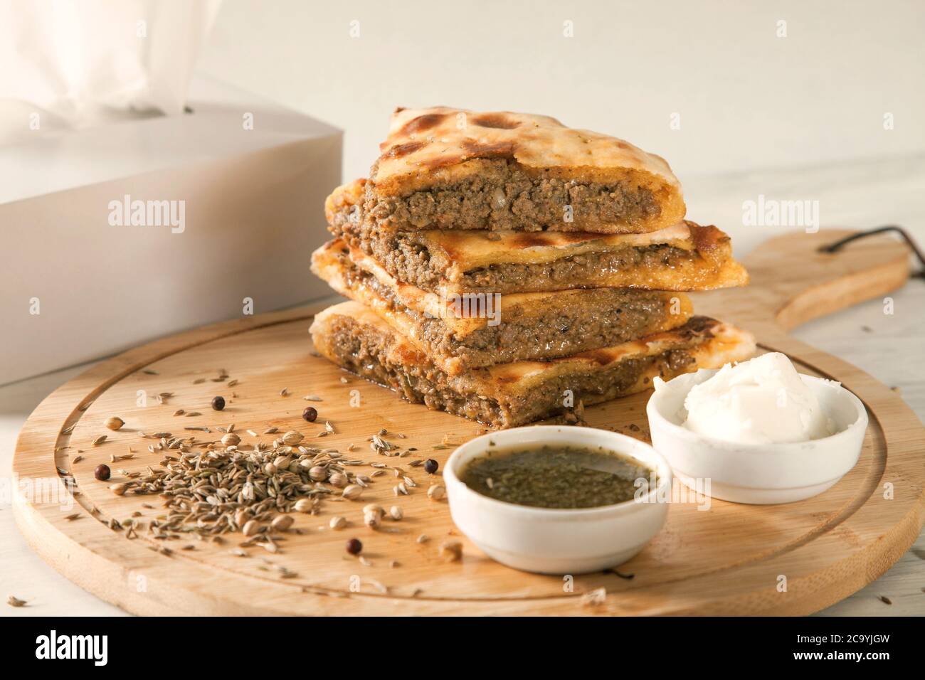 Stuffed qeema minced meat naan with herbs and spices and white butter ...