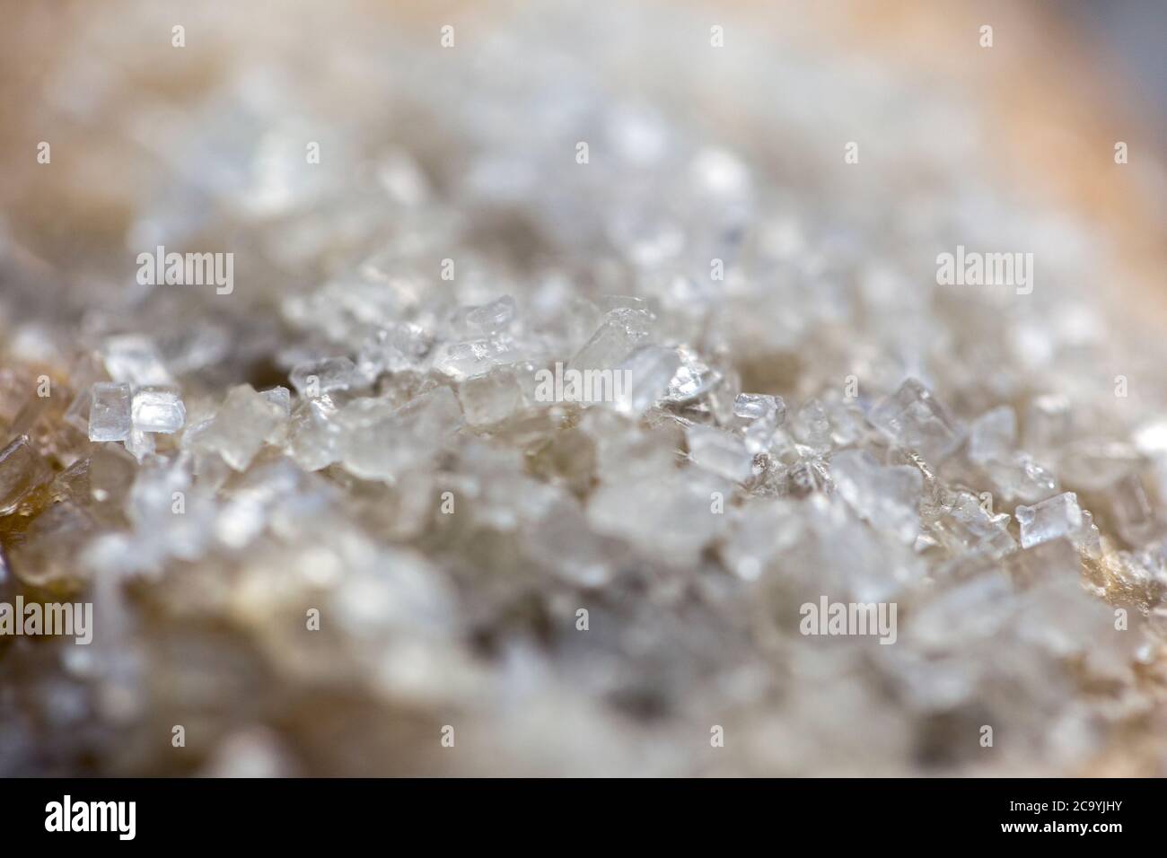 Macro photograph of sugar granules on a golden pastry Stock Photo - Alamy