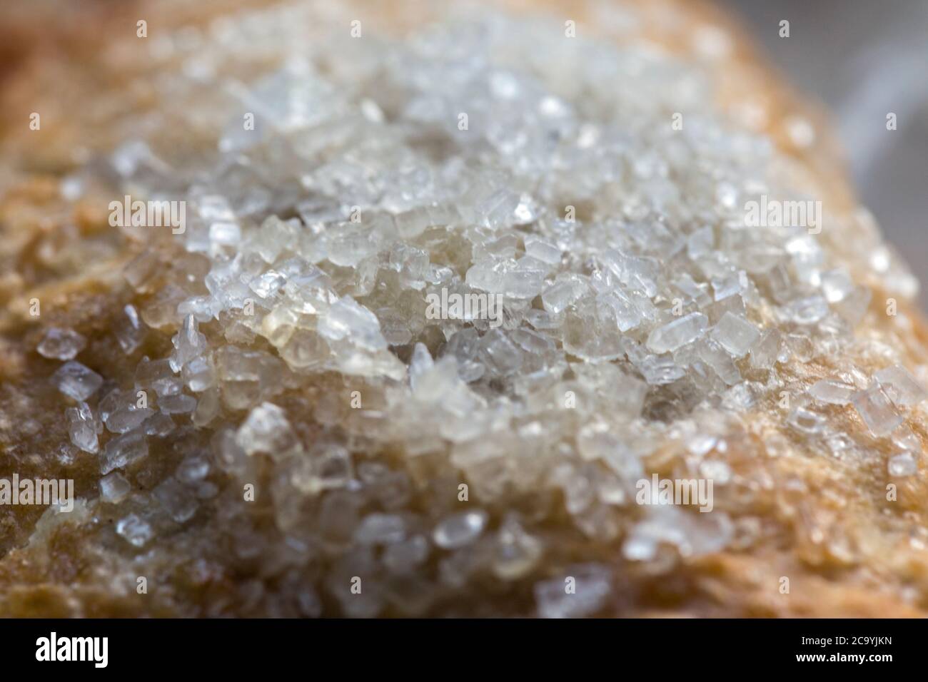 Macro photograph of sugar granules on a golden pastry Stock Photo - Alamy