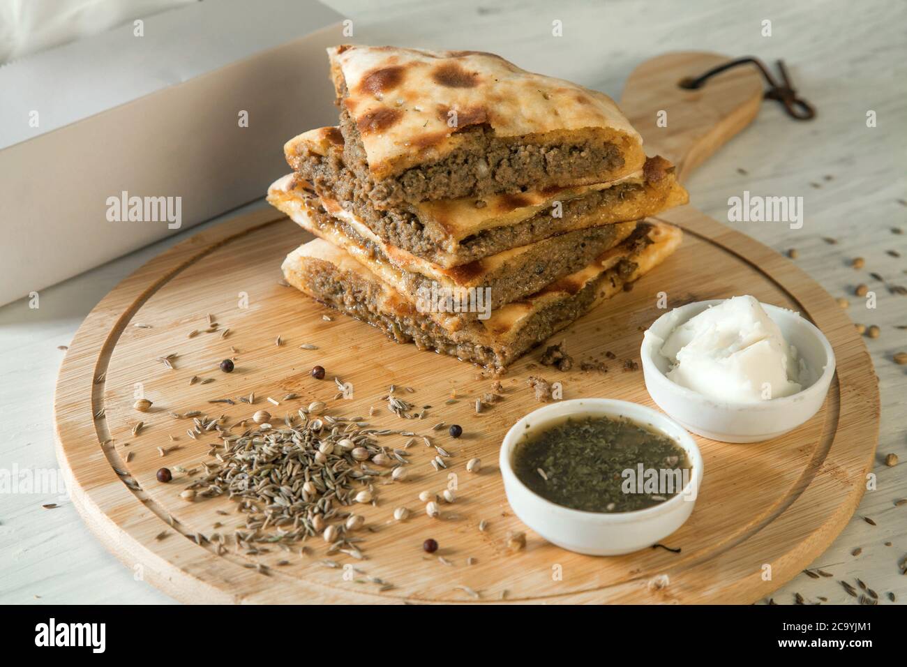Stuffed qeema minced meat naan with herbs and spices and white butter ...