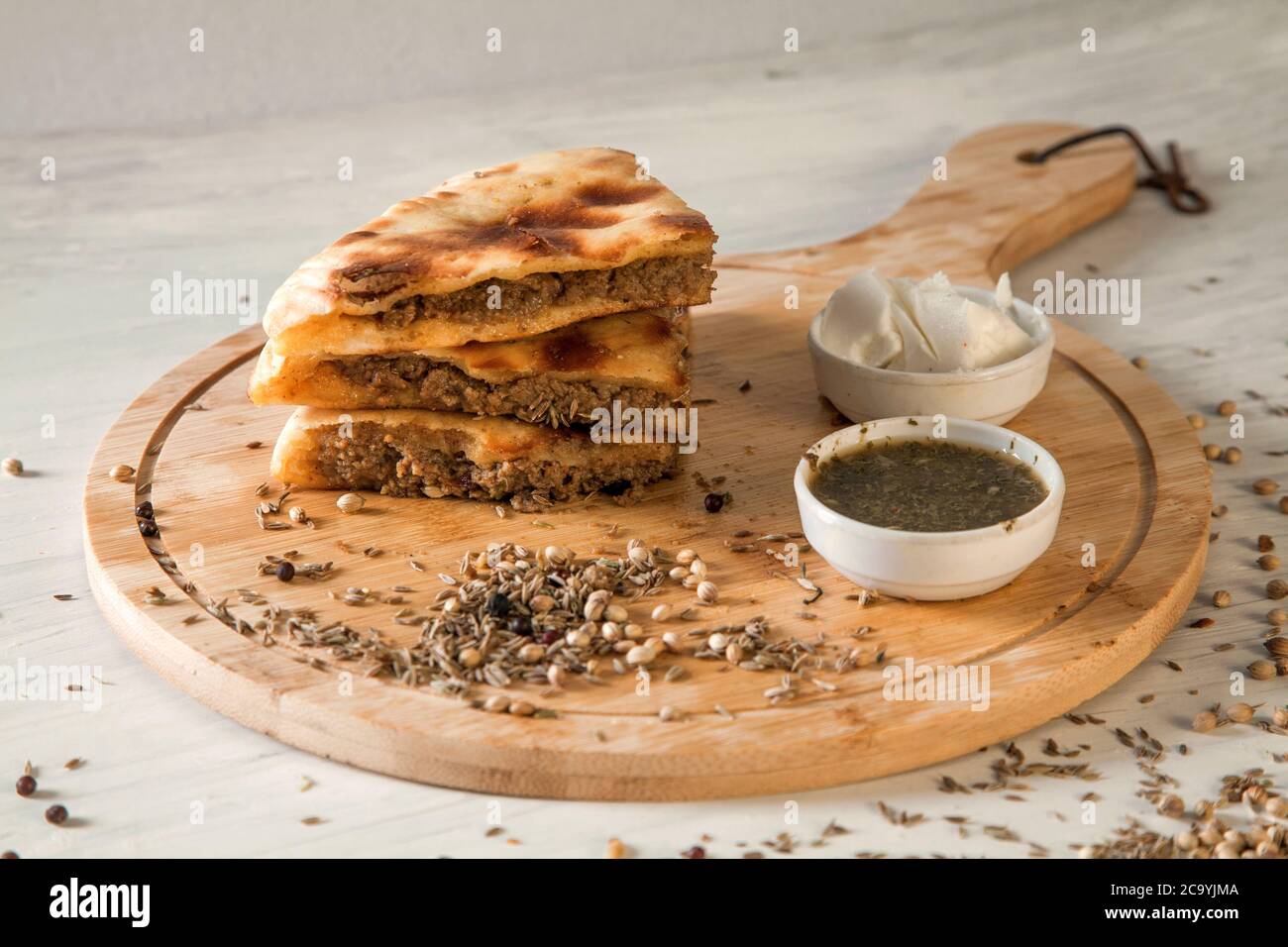 Stuffed qeema minced meat naan with herbs and spices and white butter ...