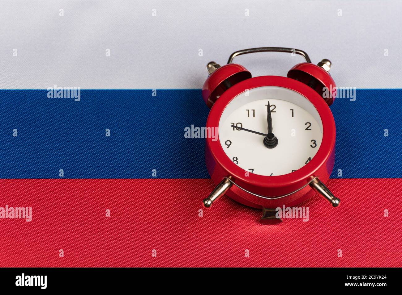 Flag of Russian Federation and vintage alarm clock close up. Time to ...