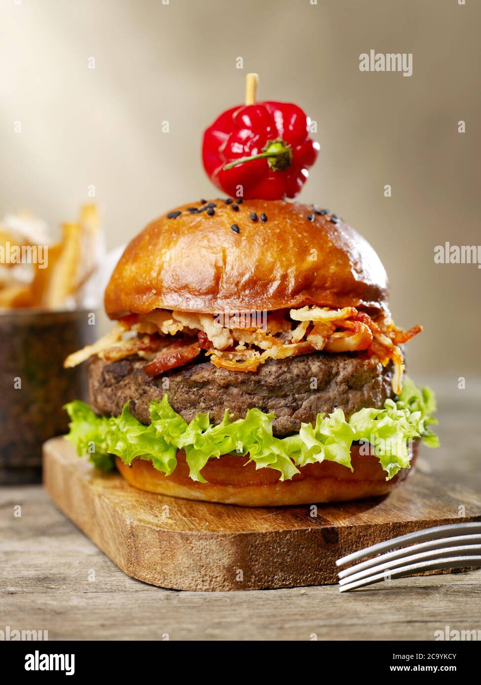 Rustic burger with fries Stock Photo - Alamy