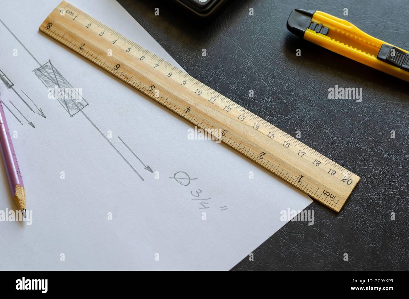 Sheet of paper with a drawing of the home water supply on the table ...