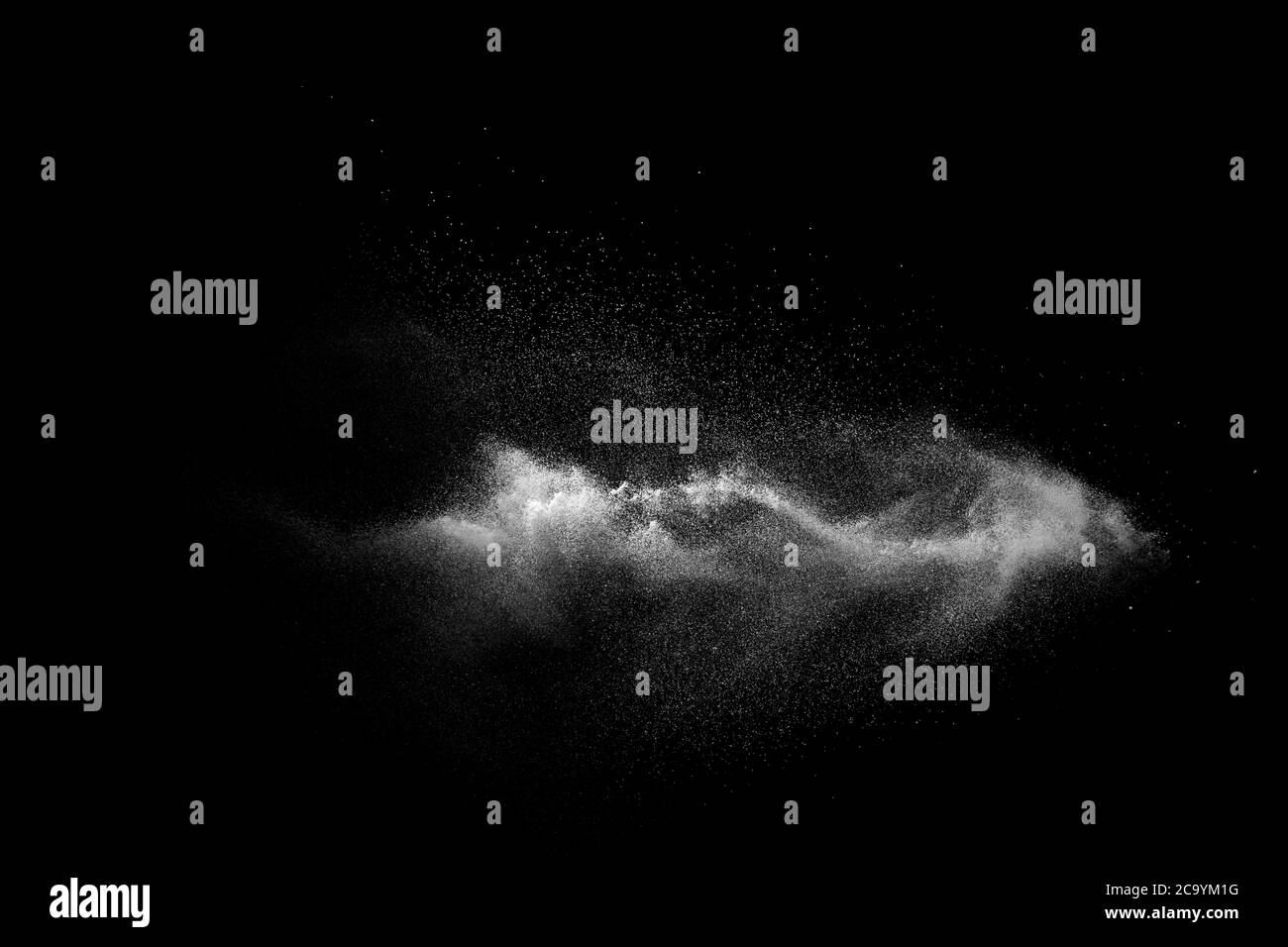 White talcume powder explosion on black background. White dust ...