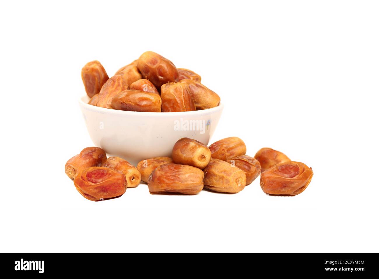 Bowl of pitted Sweet dried dates fruit isolated on white background ...
