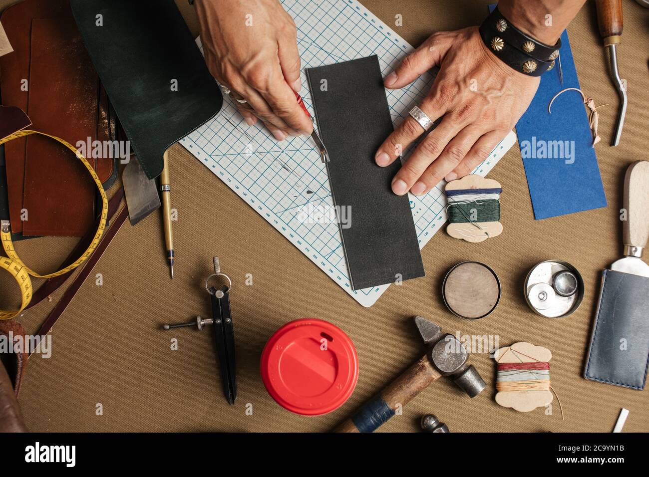Tools and equipment for leather handmade goods. Cropped image of a male ...