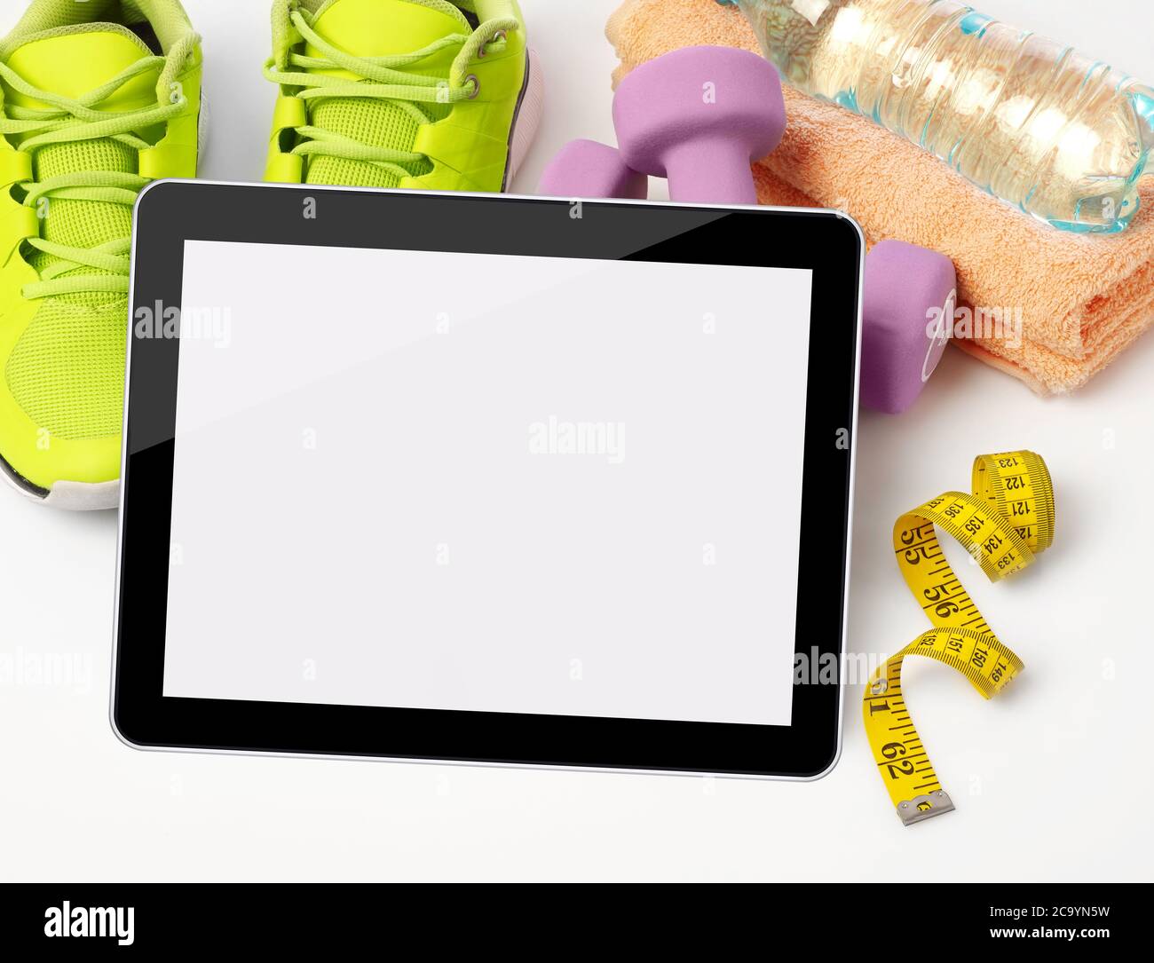 Digital tablet with blank screen and fitness equipment Stock Photo - Alamy