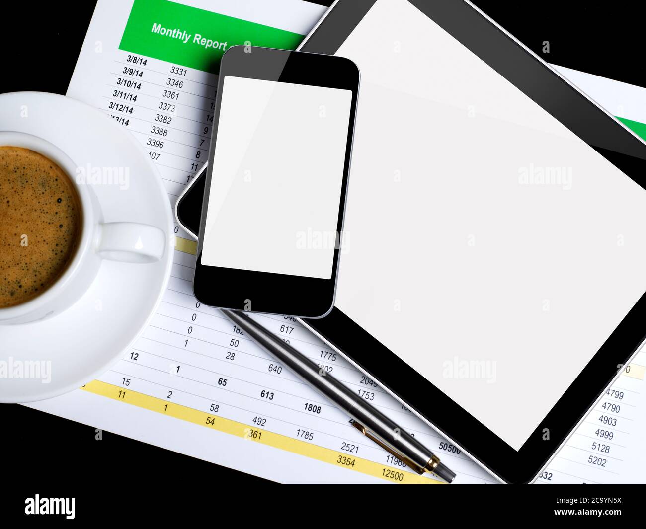 Digital tablet and mobile phone on desk Stock Photo - Alamy