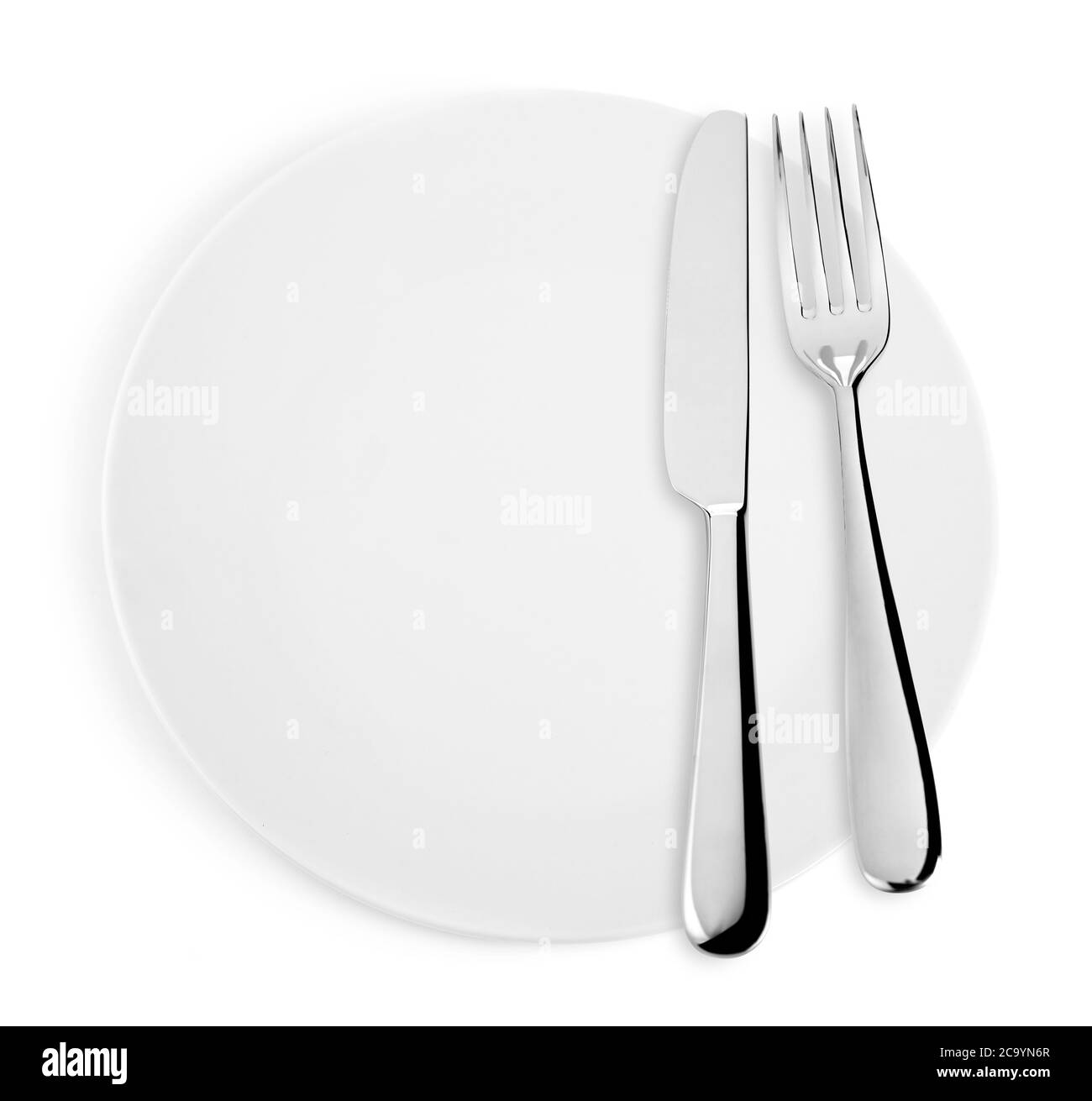 Dinner place setting isolated on white Stock Photo - Alamy