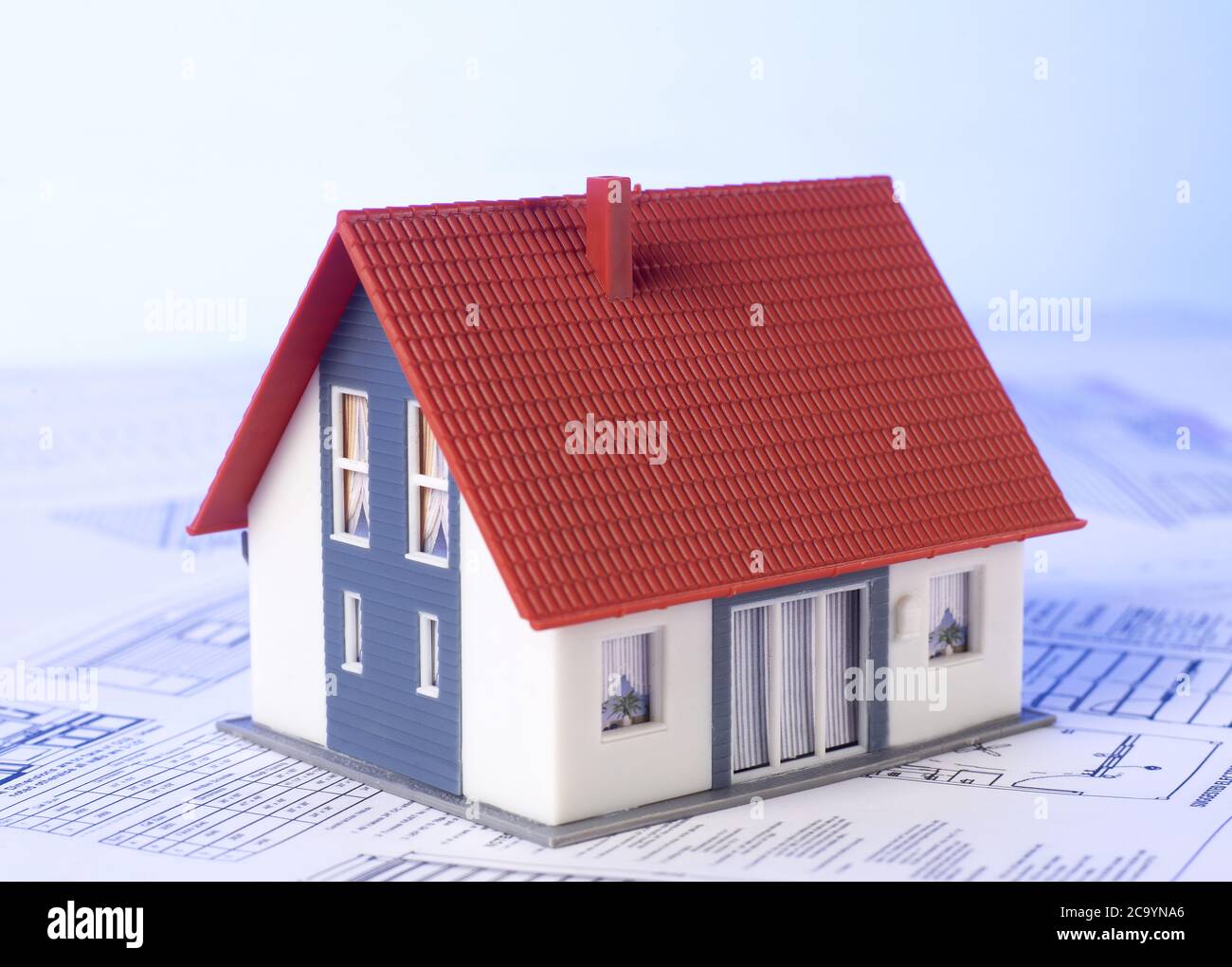 Model house and blueprints Stock Photo - Alamy