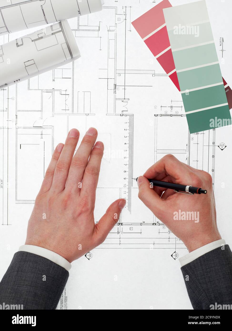 Engineer drawing on blueprints Stock Photo - Alamy