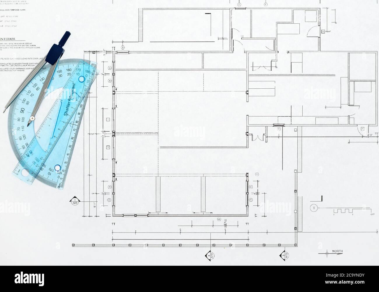 Rulers, drawing compass and blueprint Stock Photo - Alamy
