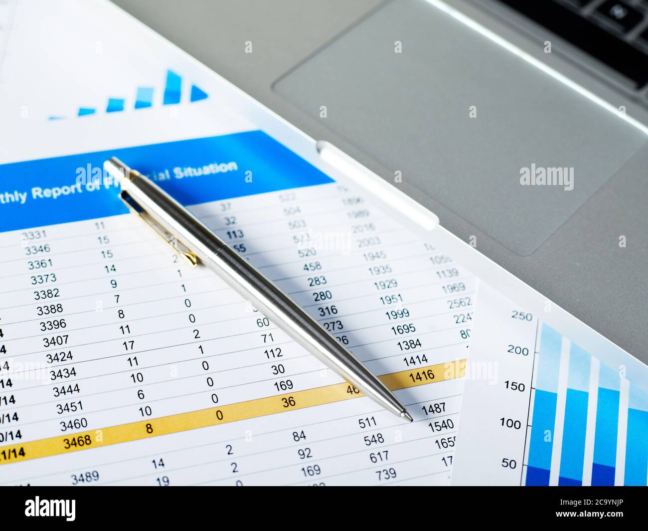 Financial papers and pen Stock Photo - Alamy