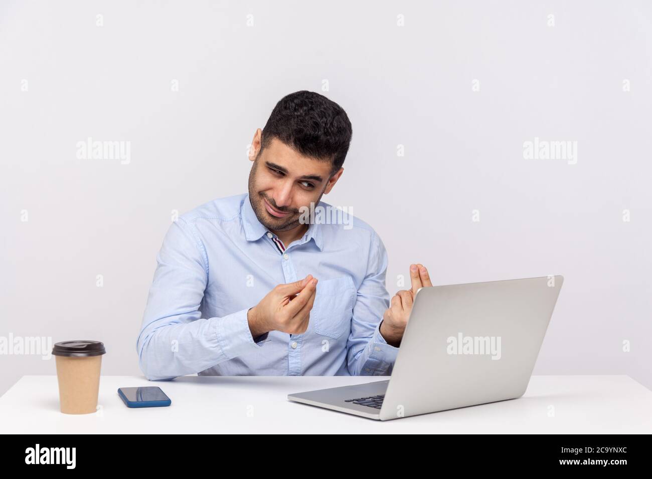 Sly businessman sitting office workplace, looking cunning expression ...