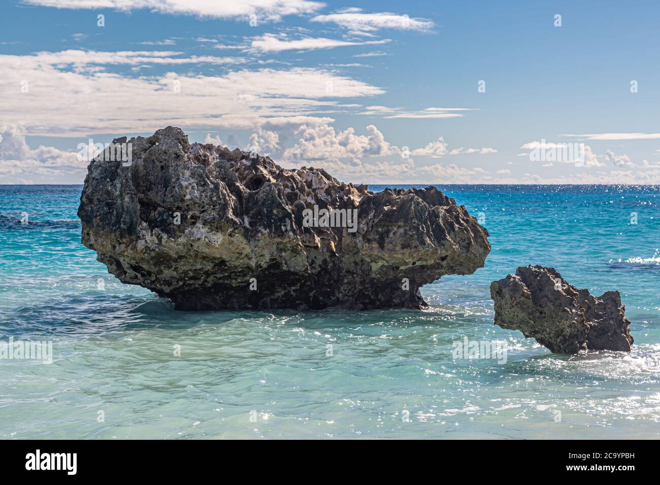 Large rocks in the turquoise ocean, at Horseshoe Bay on the Island of ...